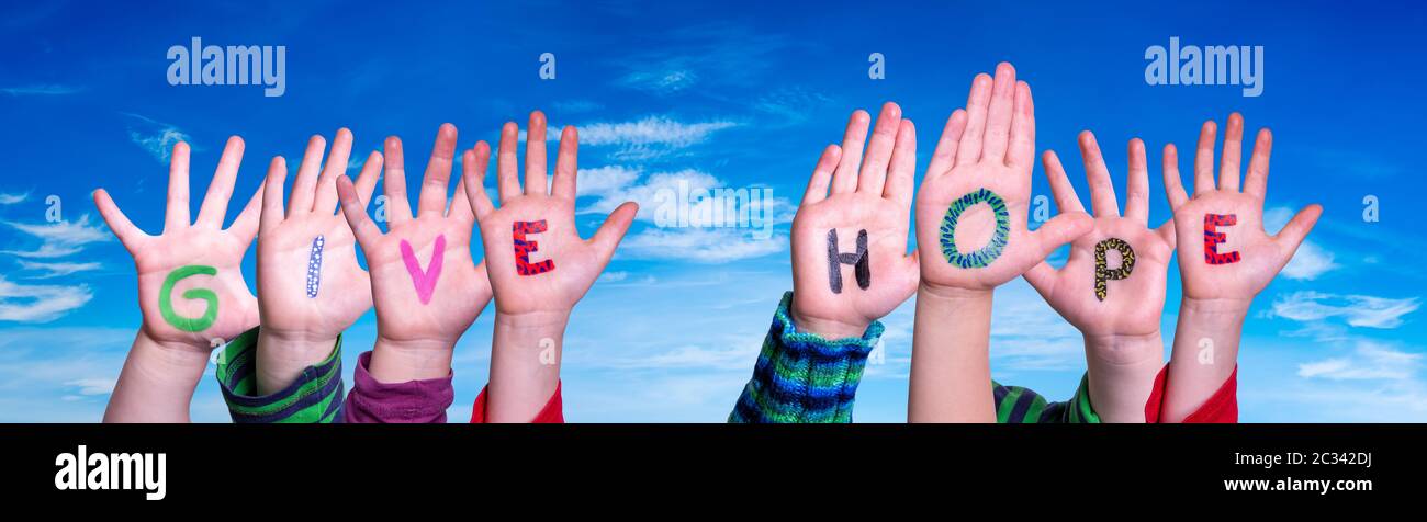 Children Hands Building Colorful Word Give Hope. Blue Sky As Background ...