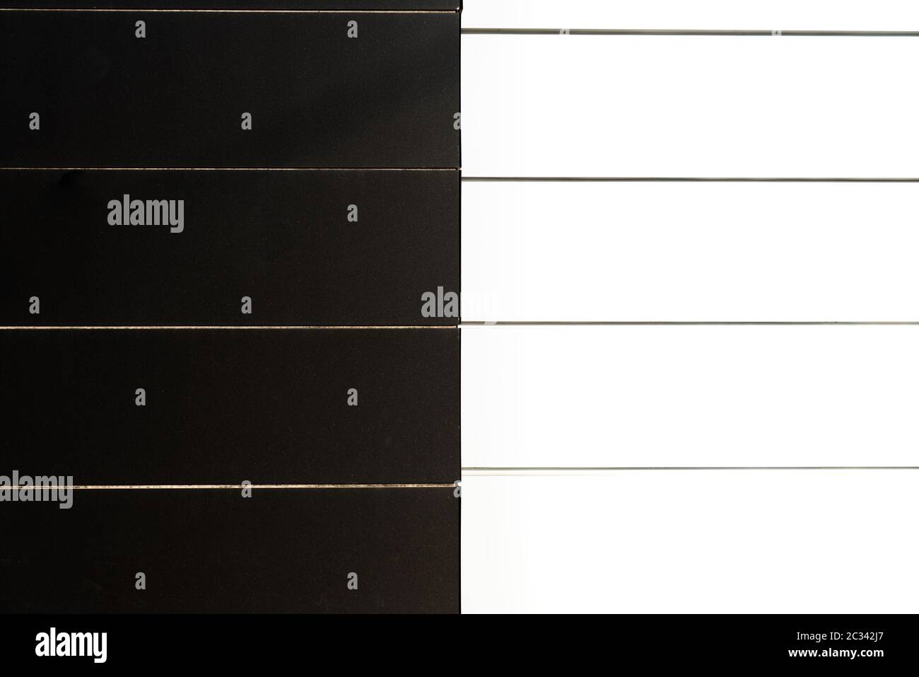 Painted wall divided into two halves in black and white Stock Photo - Alamy