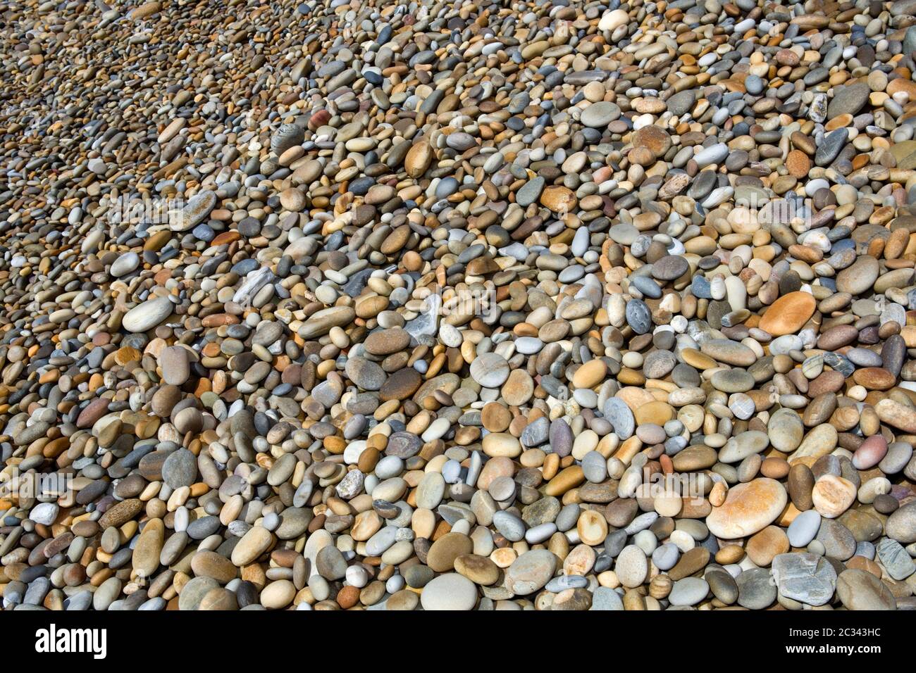 colorful pebble stone background, at the beach Stock Photo - Alamy