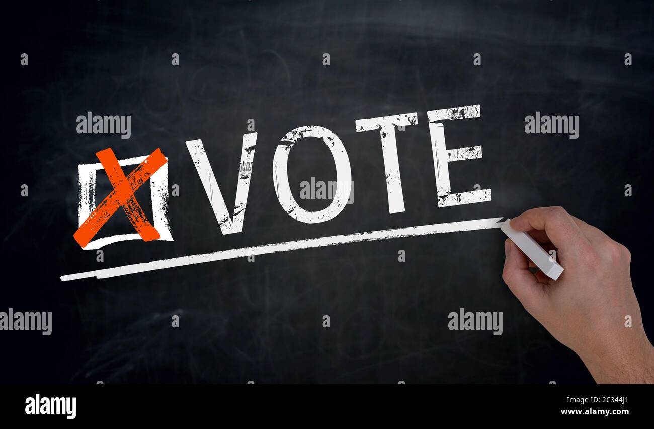 Vote is written by hand on blackboard Stock Photo - Alamy