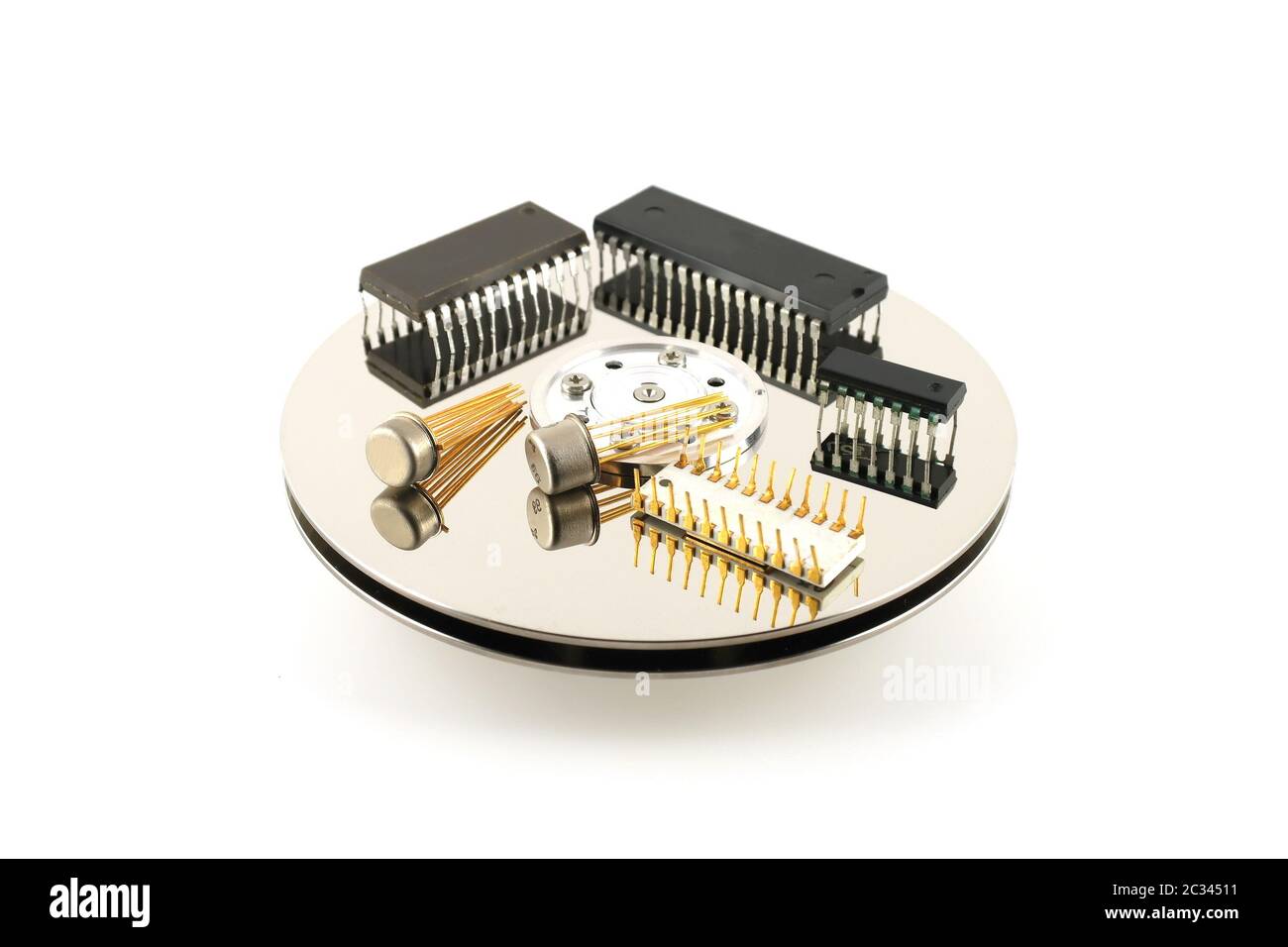 Elements of hard drive with chips over white Stock Photo - Alamy