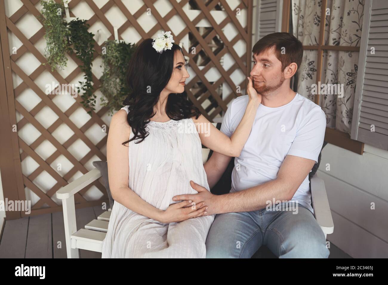 Pregnancy concept - happy man hugging his beautiful pregnant wife at ...