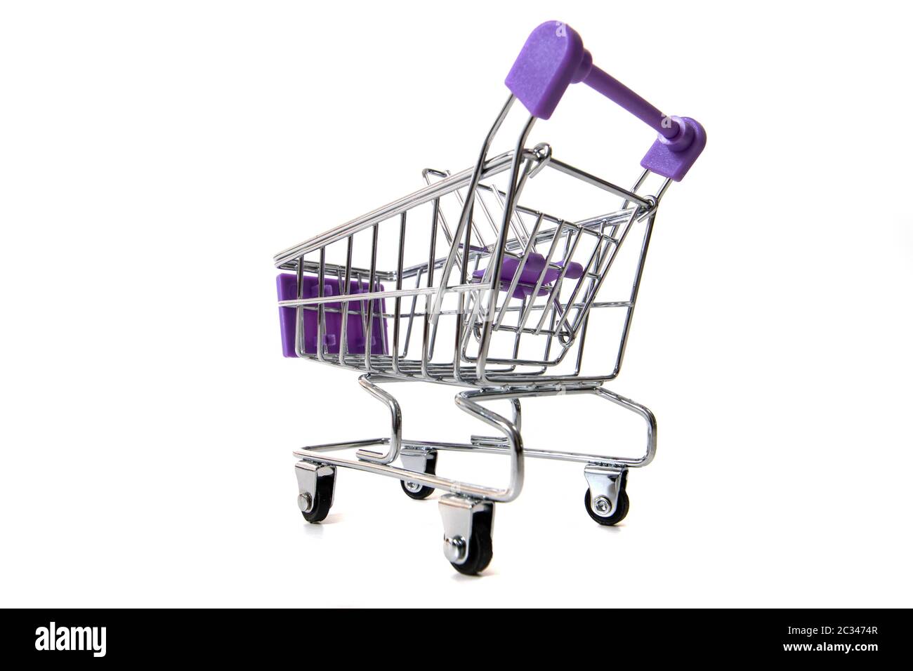 Miniature shopping cart isolated on white background Stock Photo - Alamy