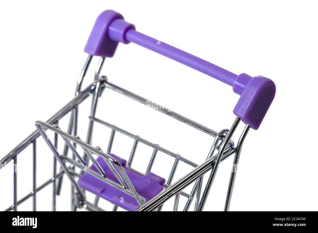 Miniature shopping cart isolated on white background Stock Photo - Alamy