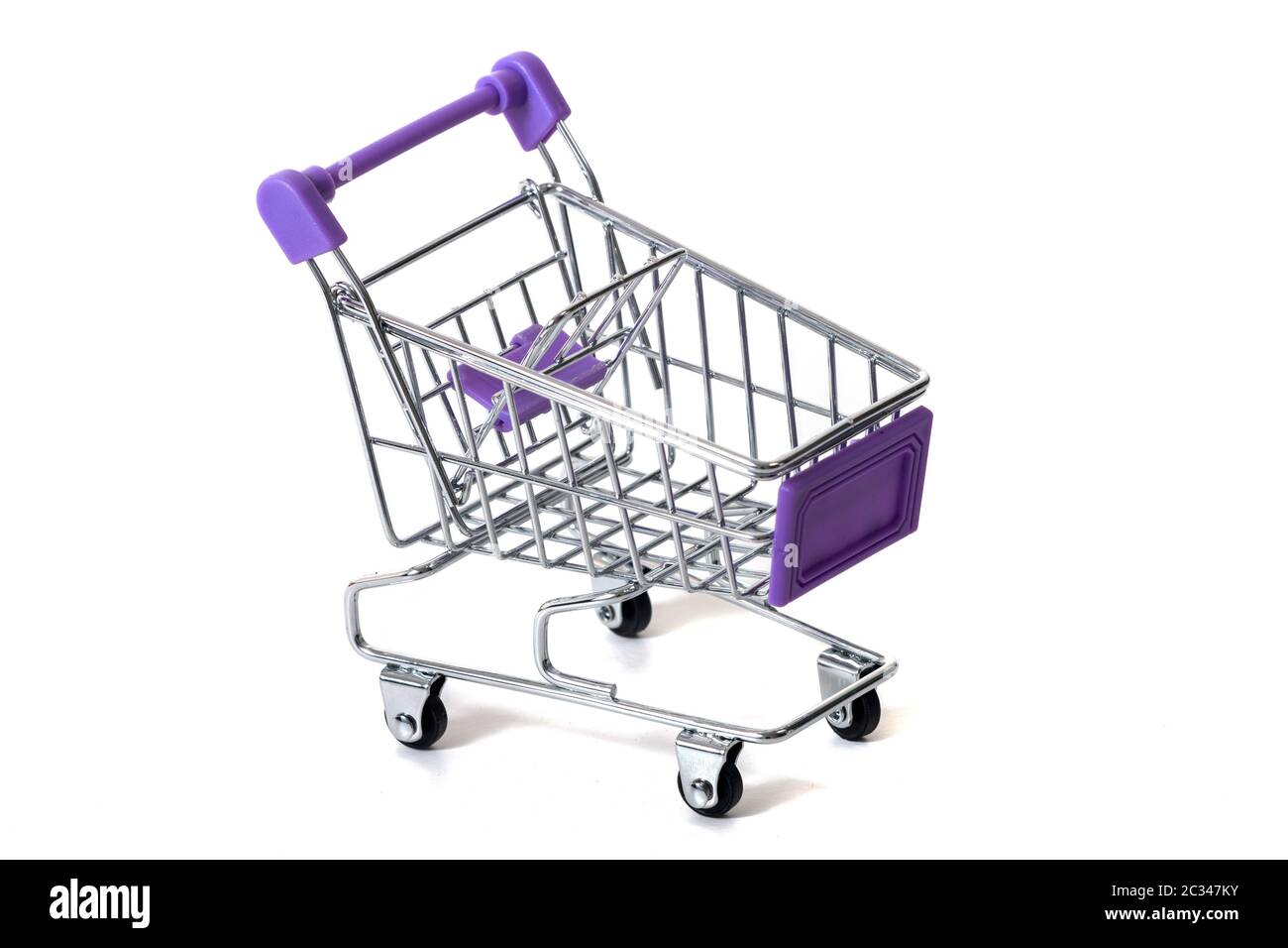 Miniature shopping cart isolated on white background Stock Photo - Alamy