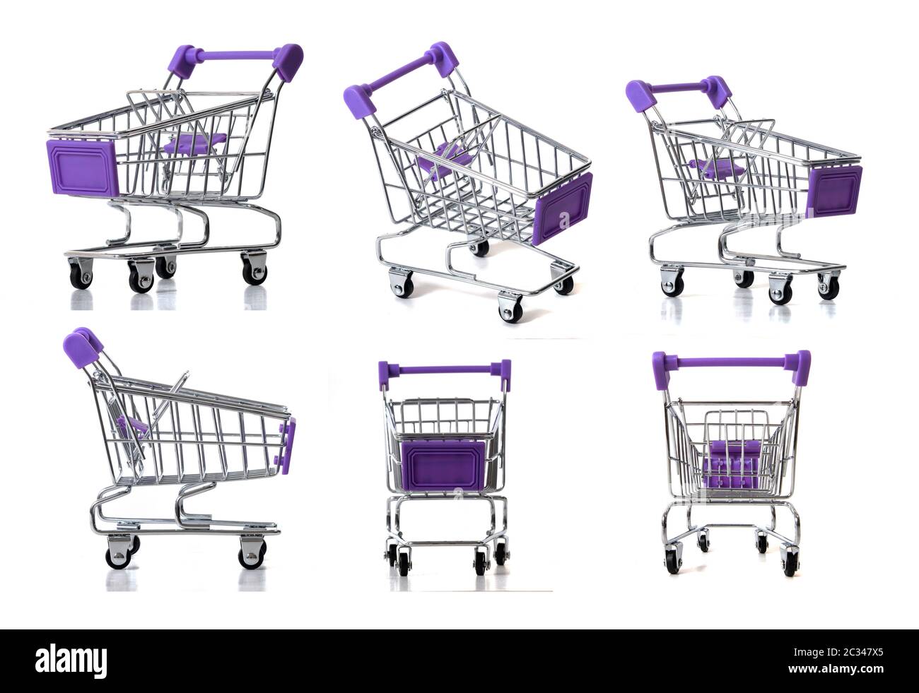 Miniature shopping carts in various angles isolated on a white ...