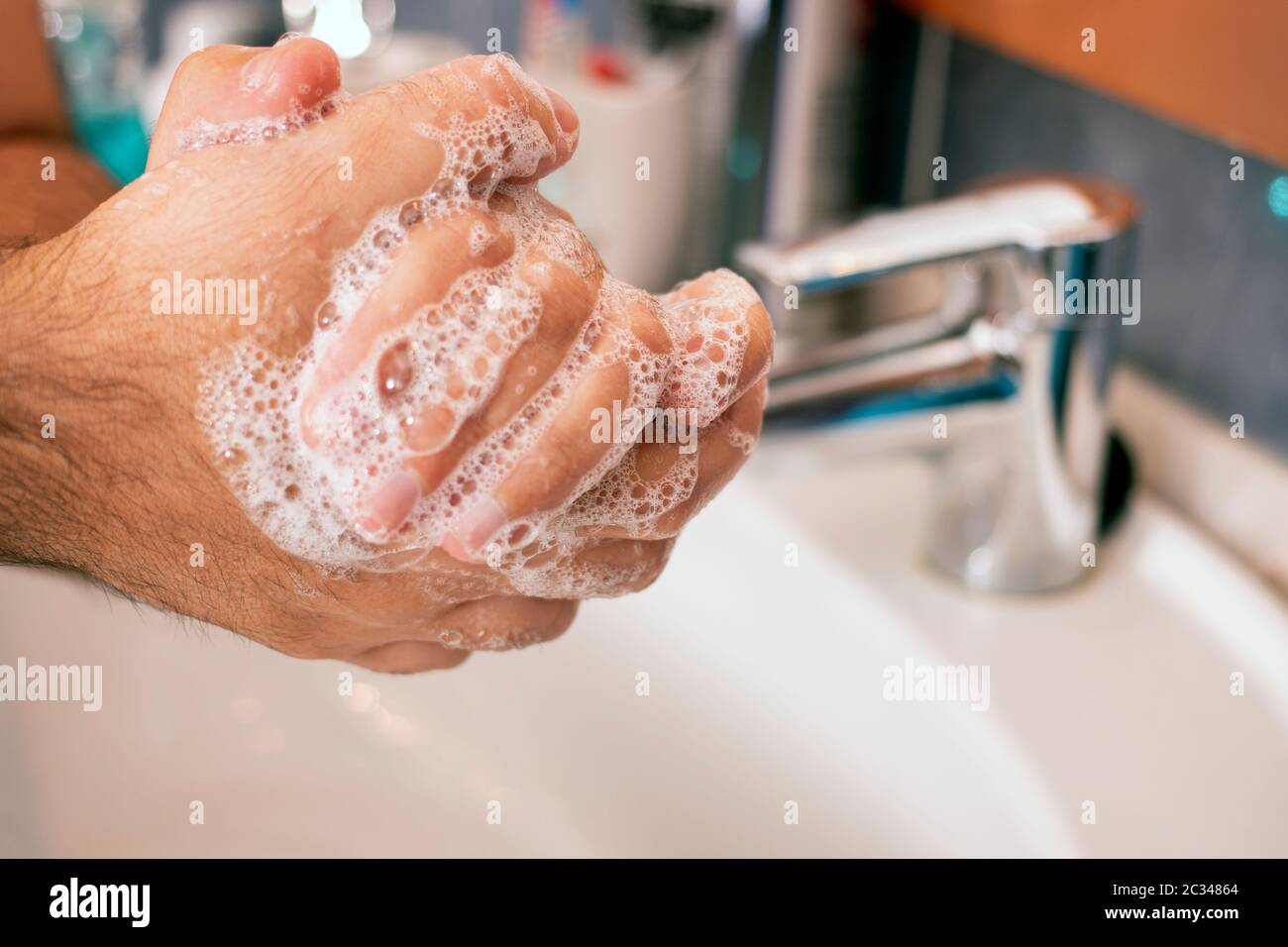 Close view of washing hands with soap for prevention of germs, viruses ...