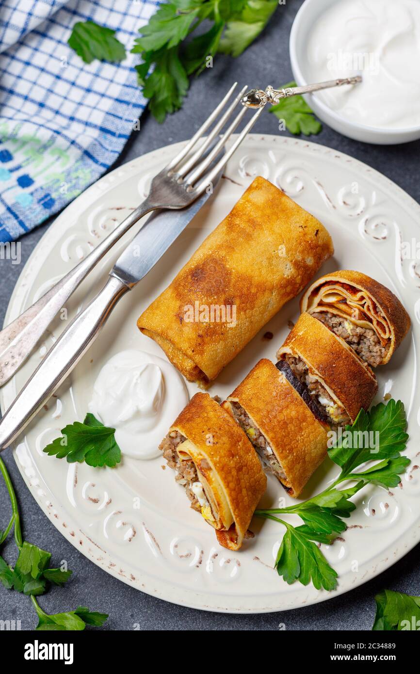 Crepes with meat and egg. Traditional Russian cuisine Stock Photo - Alamy