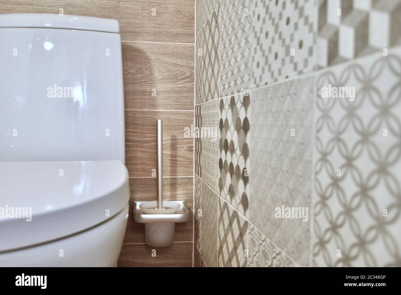 Fragment of the toilet. The area near the toilet, a sanitary brush ruff ...