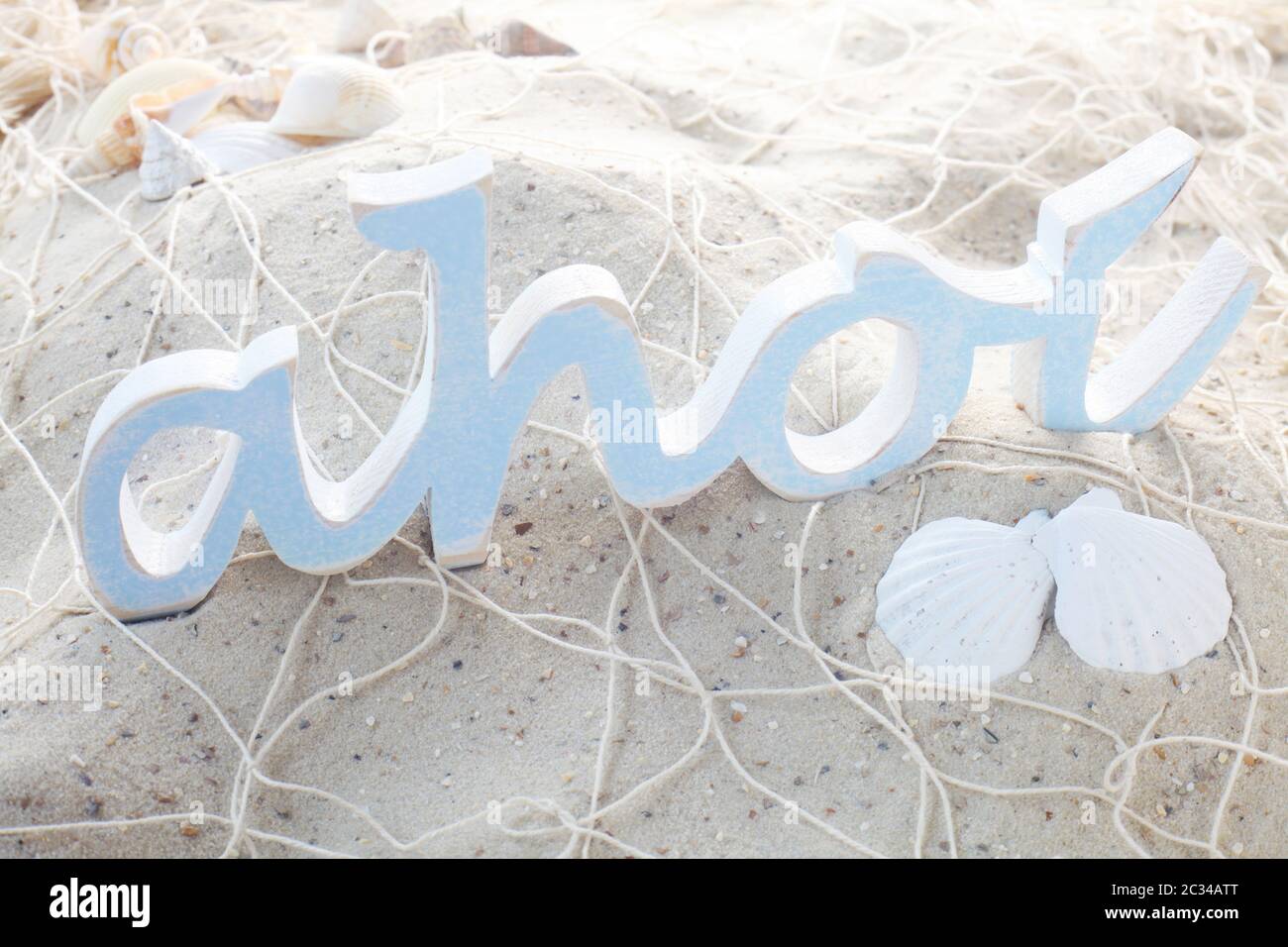 The Word "Ahoi" In Wood On Sand Stock Photo - Alamy