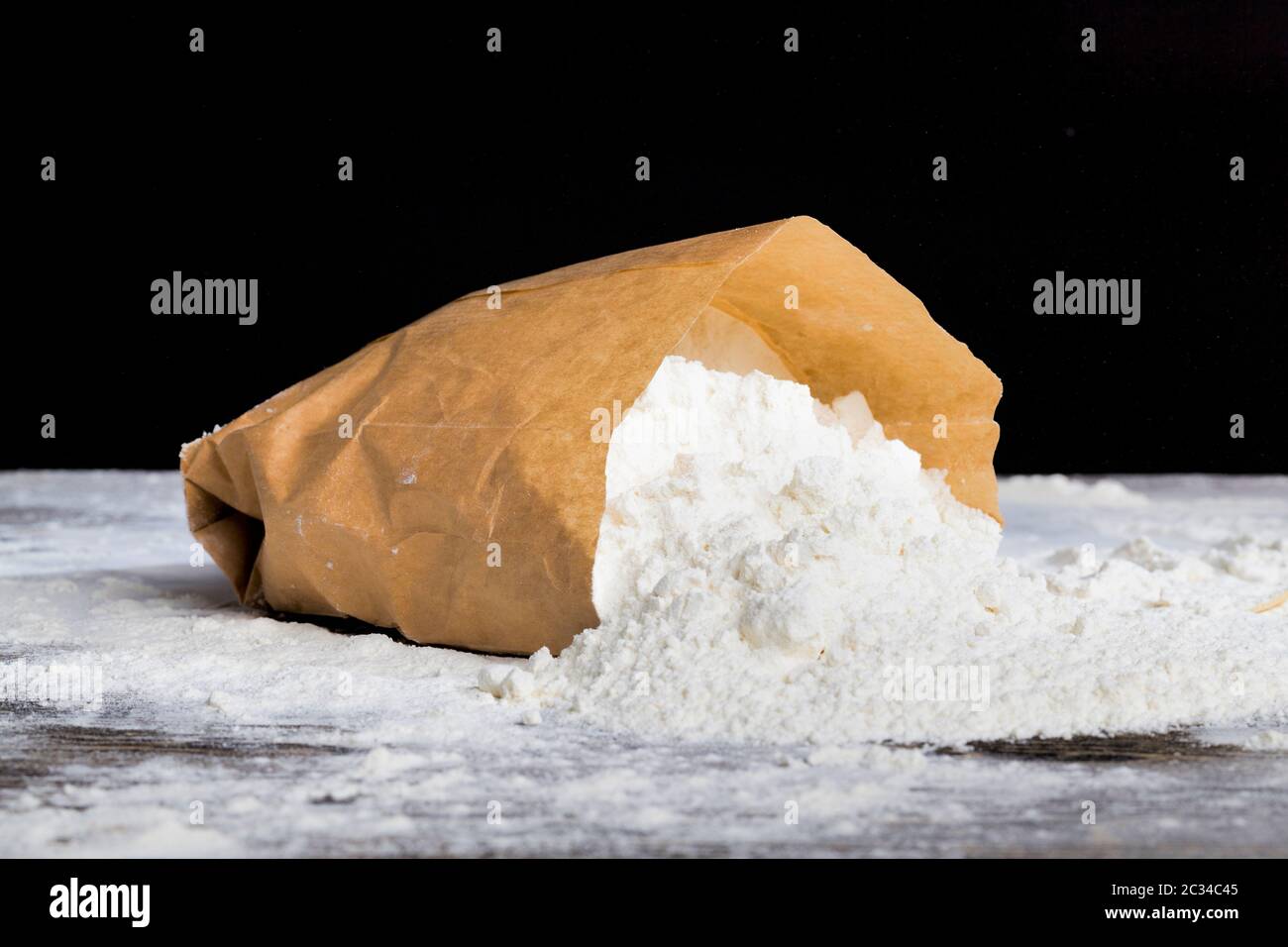 white wheat flour on the Board, close-up in the kitchen while cooking ...