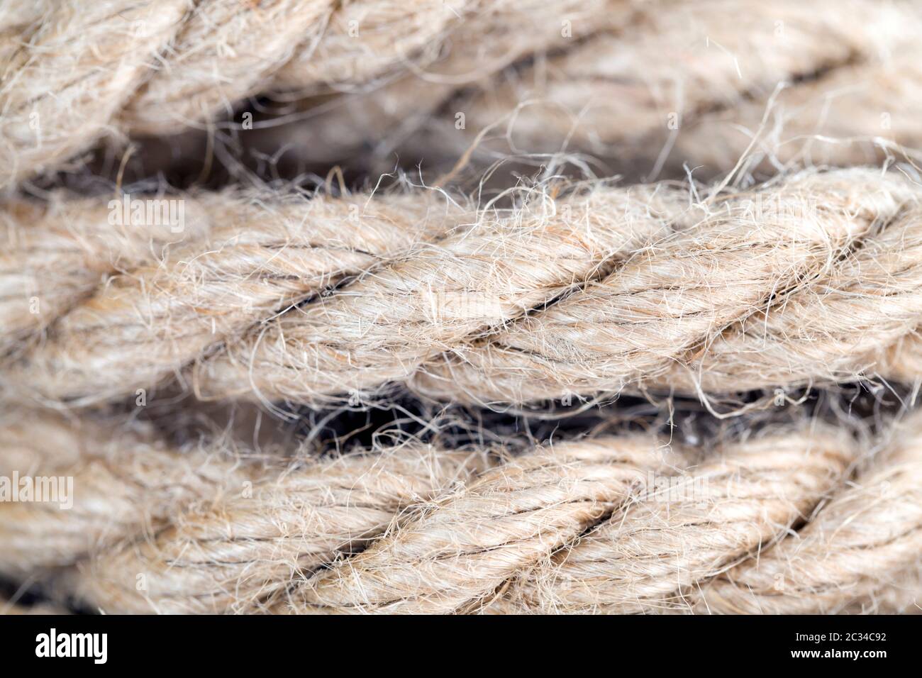 thick linen gray rope, details and structure of the rope close-up, used ...