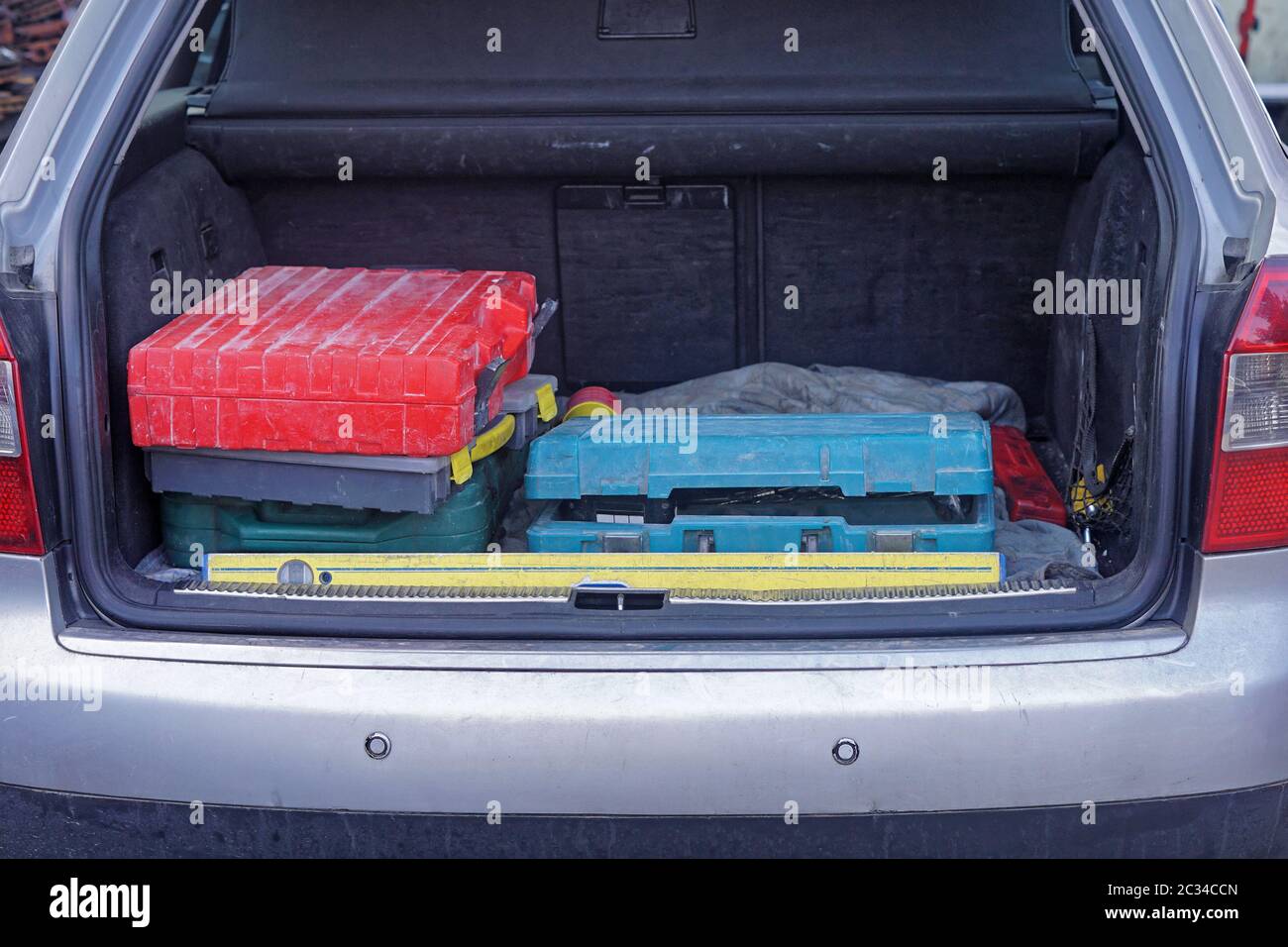 Boxes of work tools in car trunk Stock Photo - Alamy