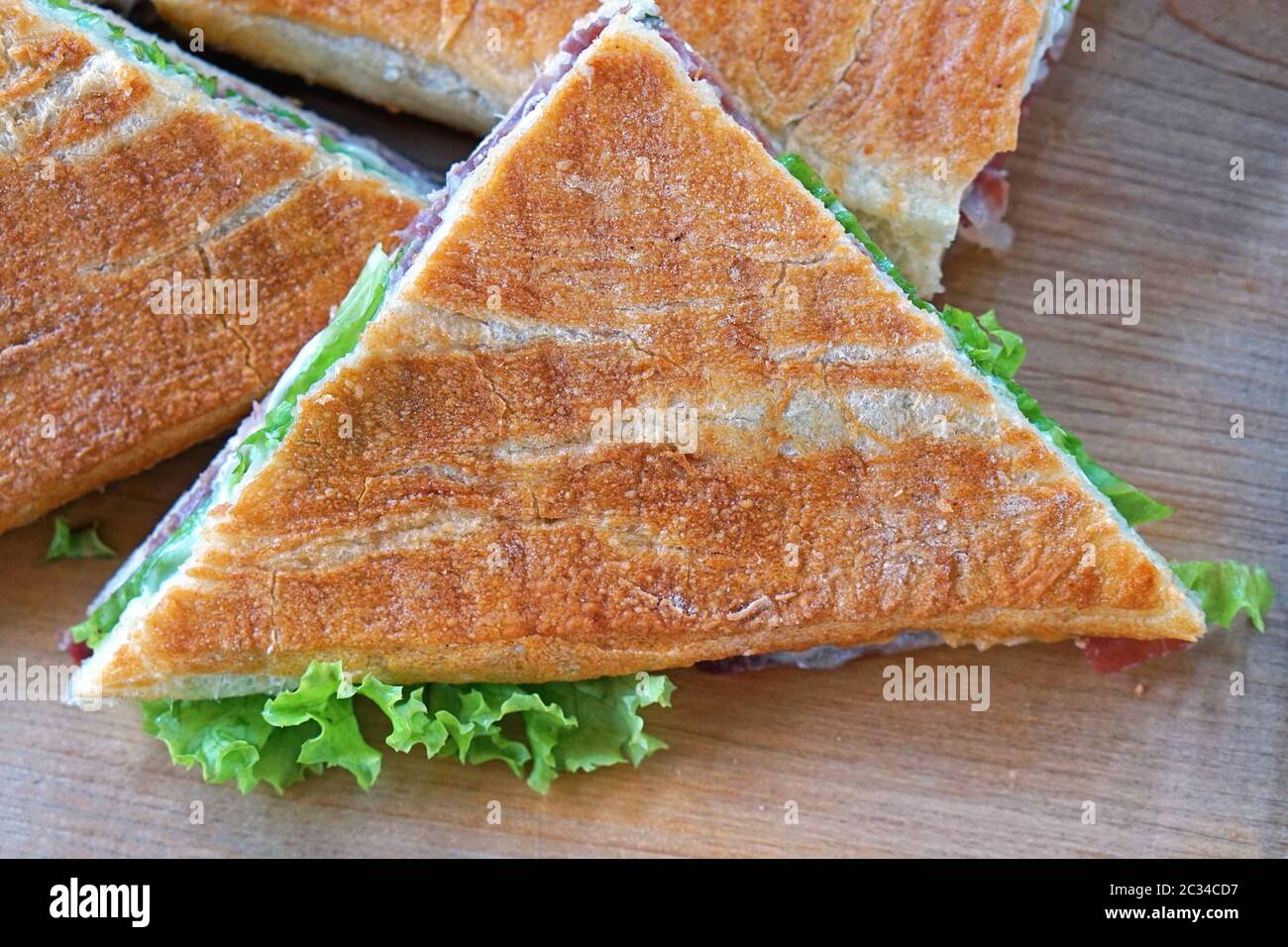Triangular toast sandwiches diagonally cut Stock Photo - Alamy
