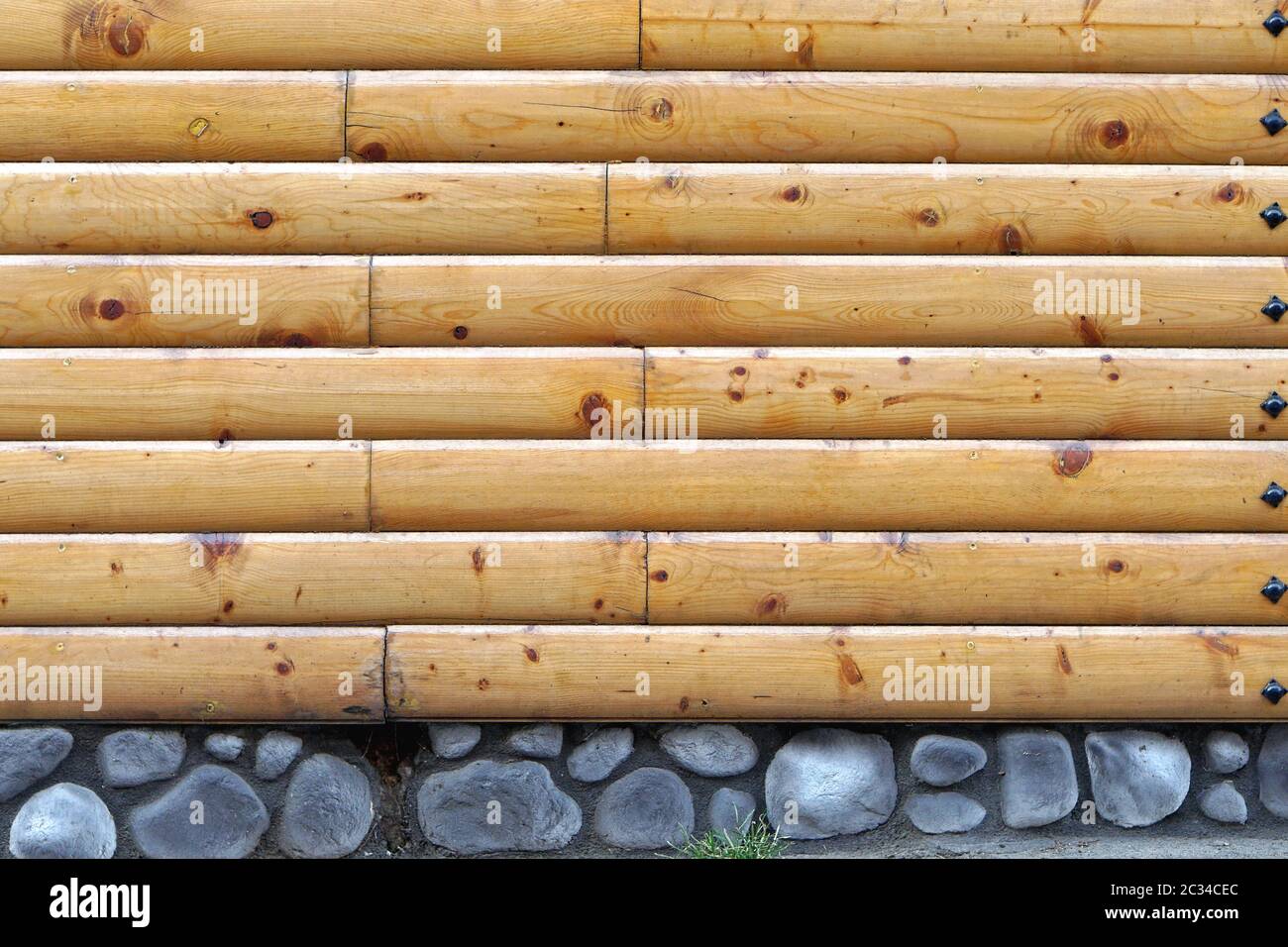 Light wood panels wall at stone base Stock Photo - Alamy