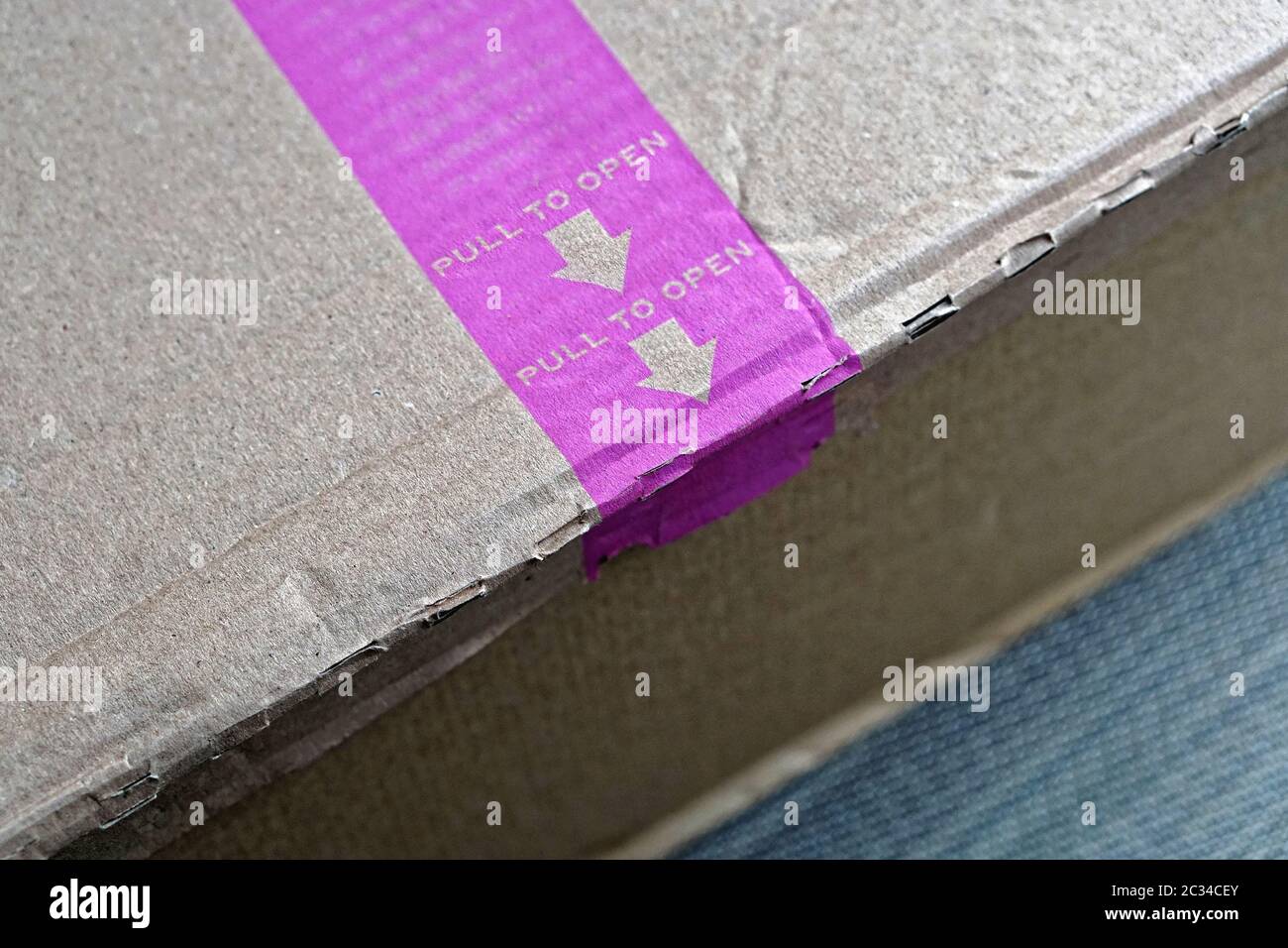 Pull to open easy strip at box Stock Photo - Alamy
