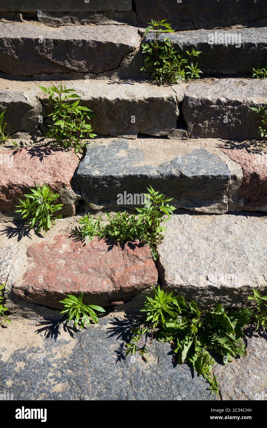 old stone crumbling staircase made of stones and cobblestones, part and ...