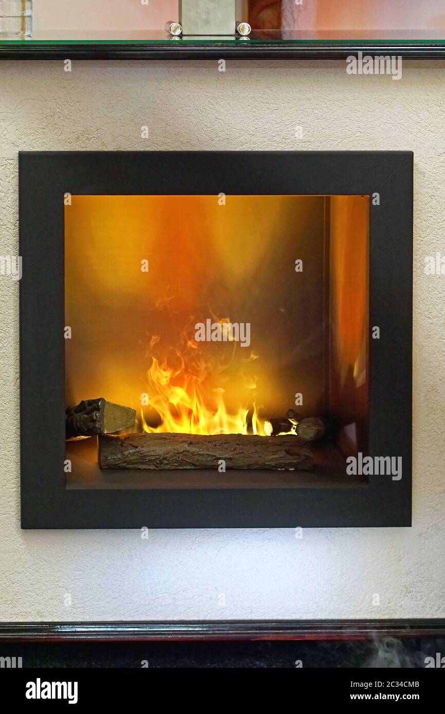 Modern square electric fireplace with led lights Stock Photo - Alamy