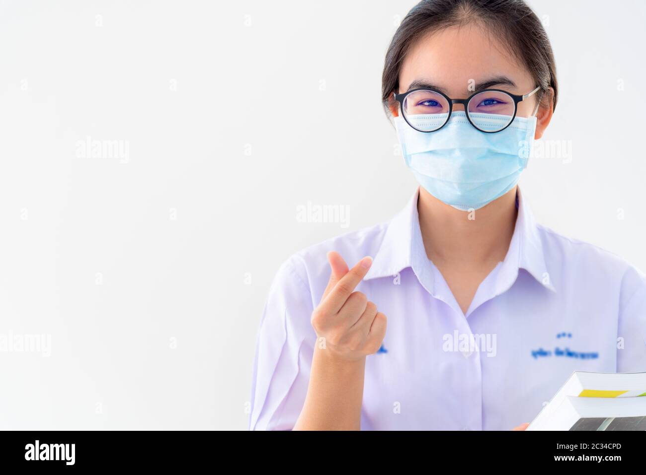 Student Asian young woman wear a mask to protect Coronavirus, Girl to ...