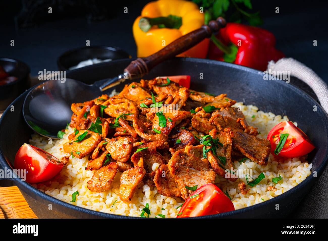 rustic bulgur pans with gratinated gyros and yoghurt Stock Photo - Alamy