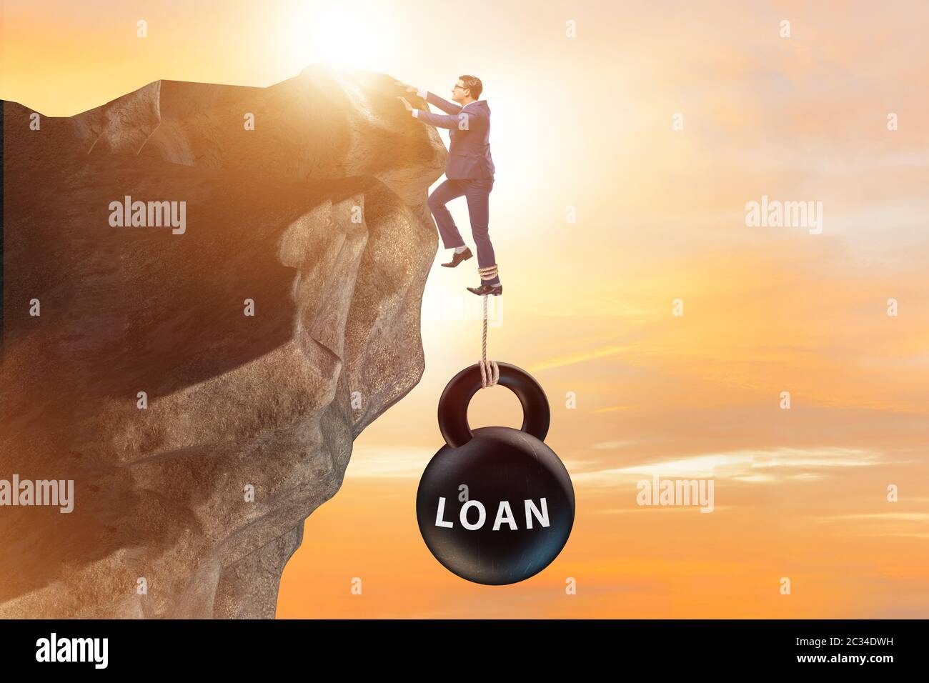 Concept of debt and load with businessman Stock Photo - Alamy