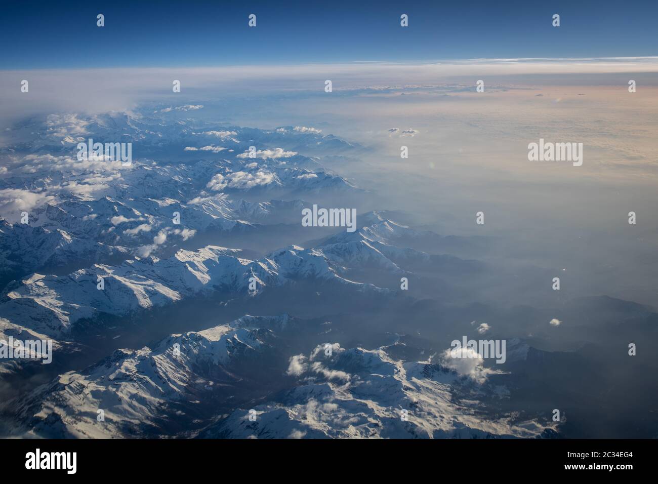 View from a cockpit of a commercial airliner airplane over a beautiful ...