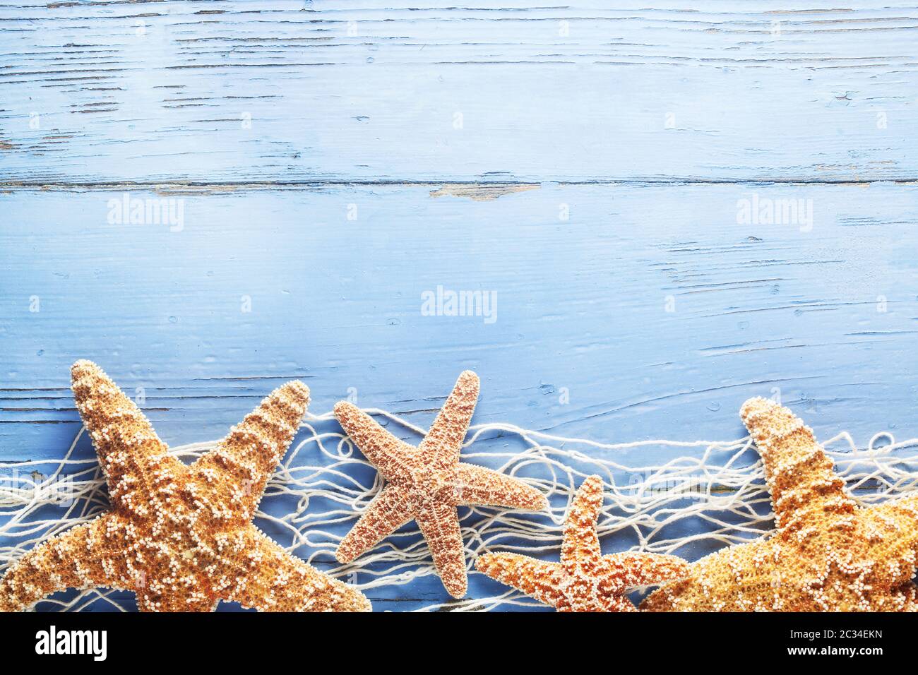 Maritime Background With Starfish And A Fishing Net Stock Photo - Alamy