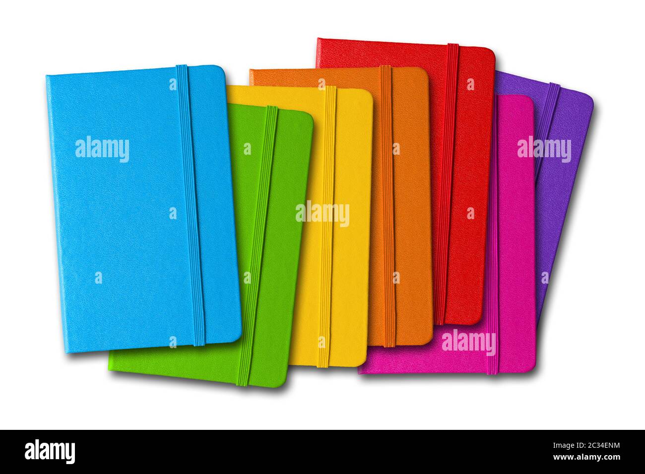 Multi color closed notebooks range isolated on white Stock Photo - Alamy