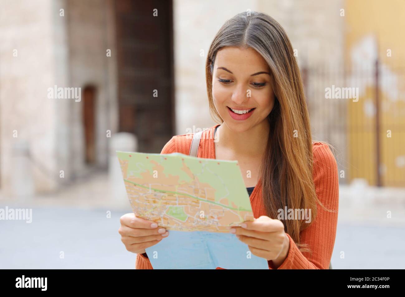 Travel girl visiting city searching direction on map. Happy cheerful ...