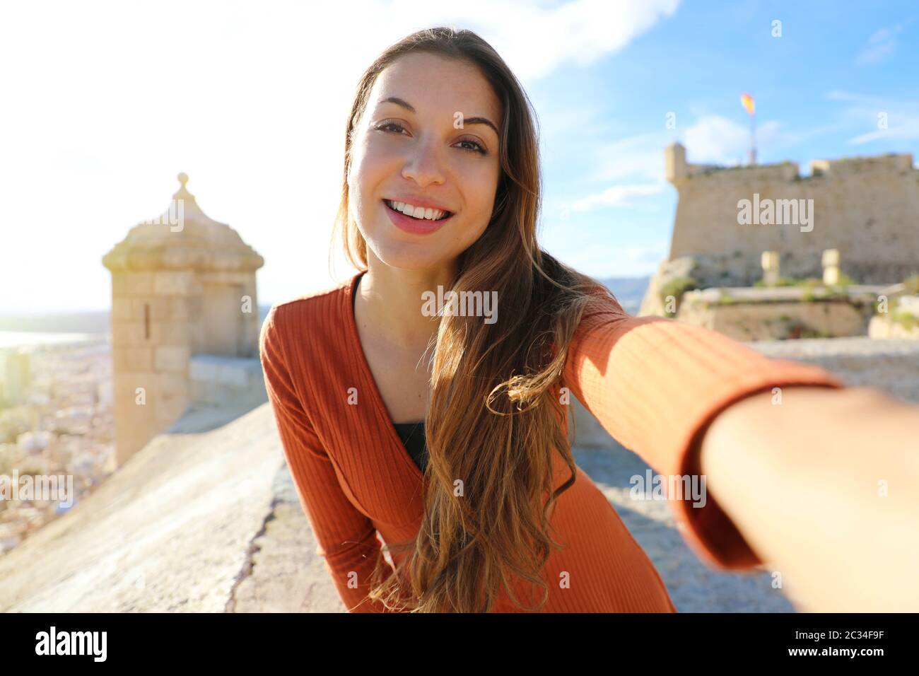 Happy beautiful tourist woman taking selfie photo in Alicante, Spain ...