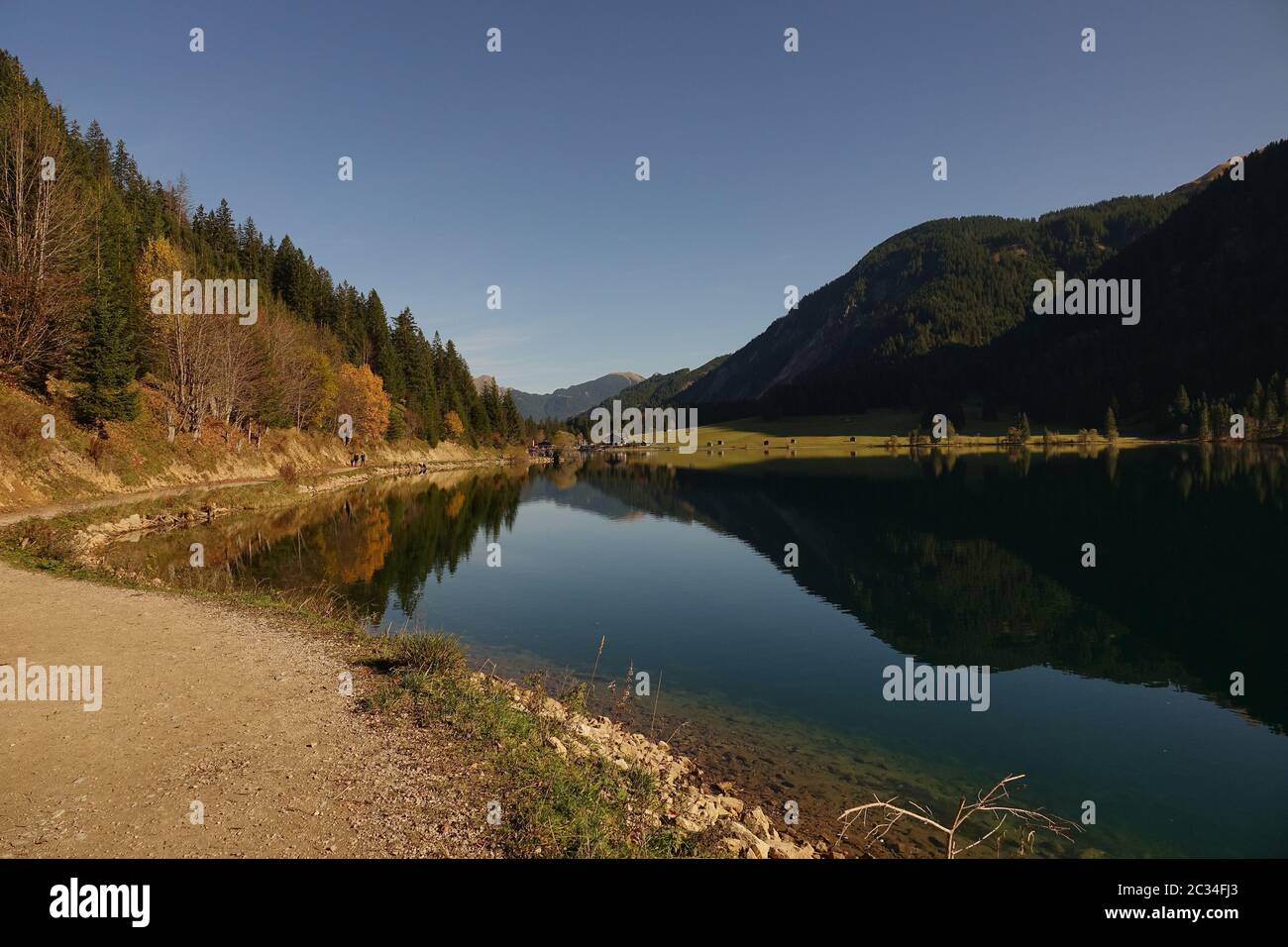 The Tyrolean mountains in Austria are reflected in the clear lake Stock ...