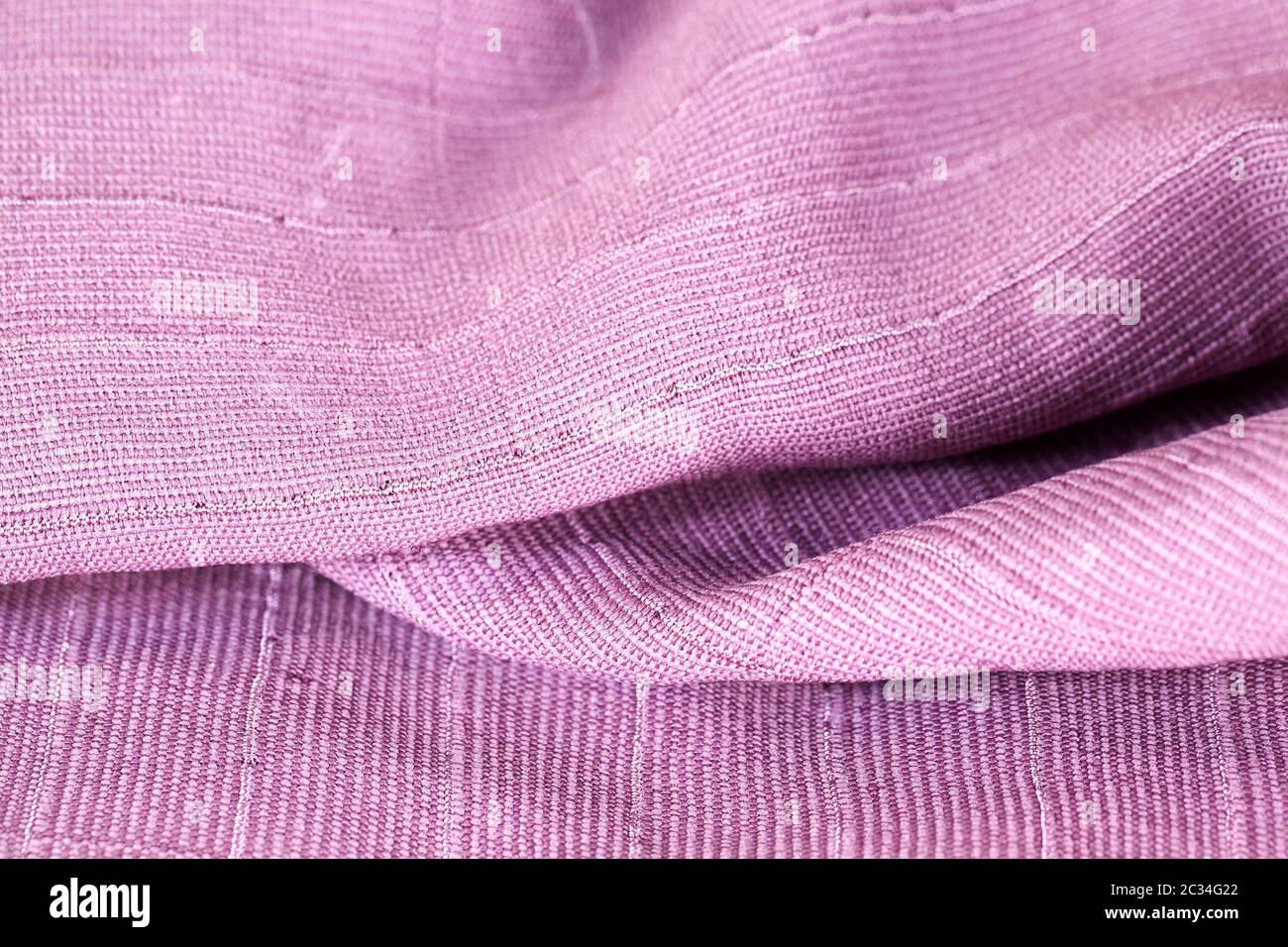 artificial material purple color with irregularly sewn structure, close ...