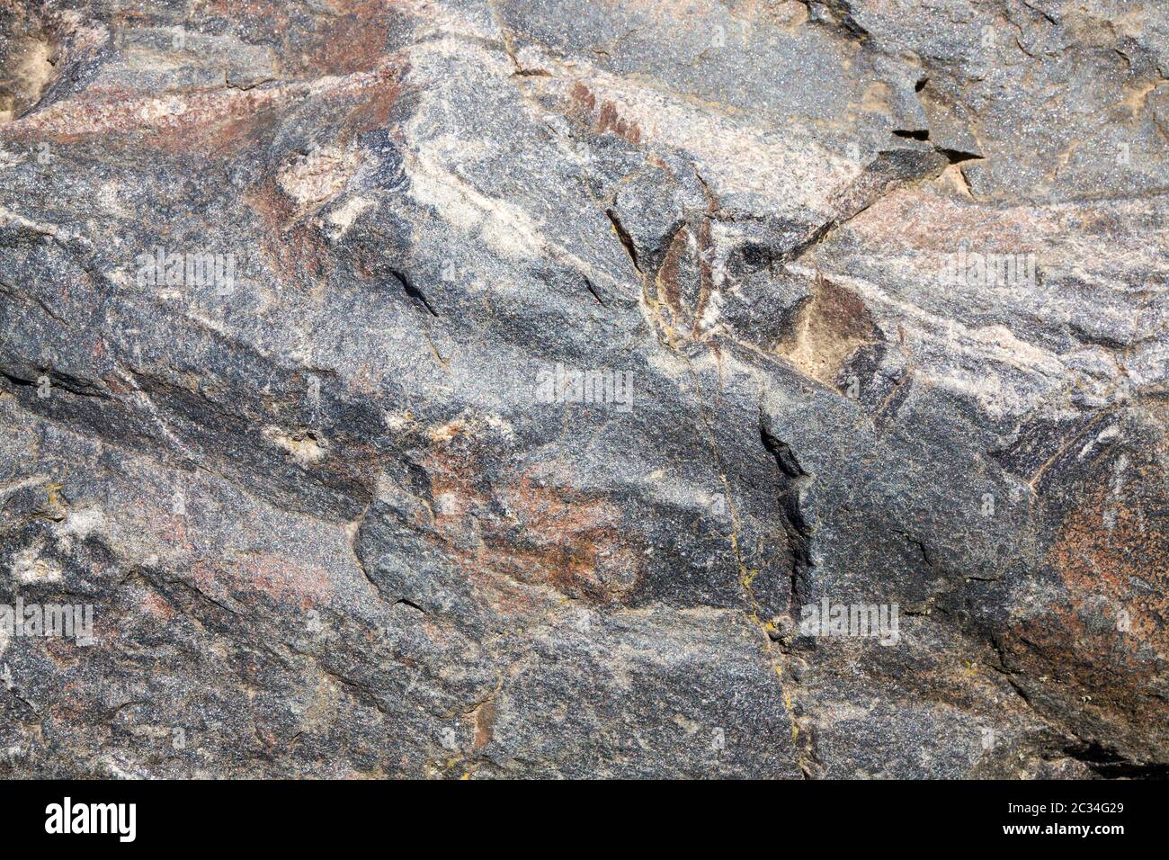 the structure of a large stone having several different colors, close ...