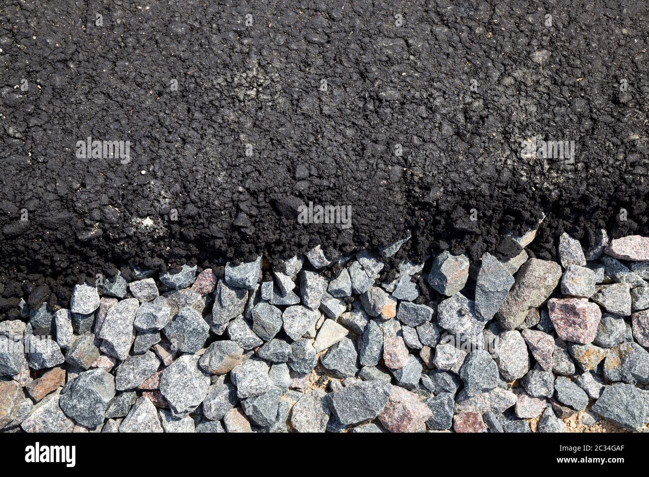 small rubble and a layer of asphalt at the construction site of a new ...