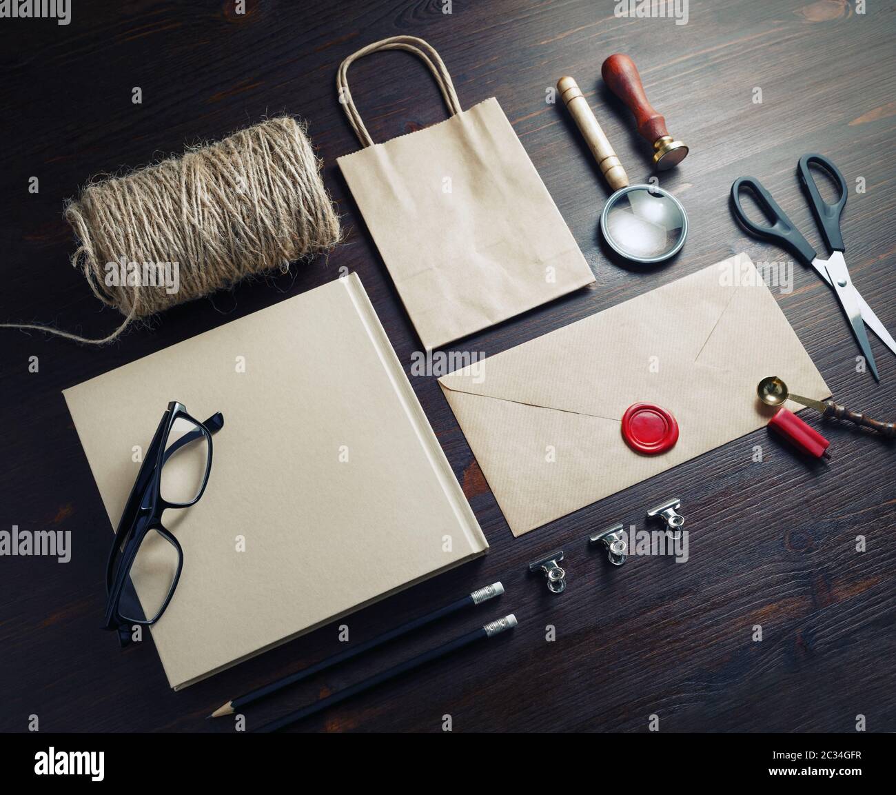 Photo of blank kraft paper stationery set on wooden background. Mock-up ...