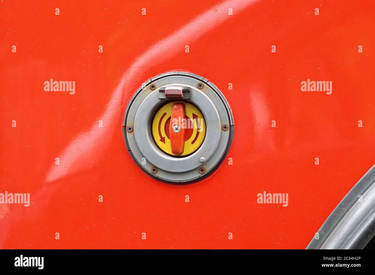 Emergency stop button at red vehicle exterior Stock Photo - Alamy