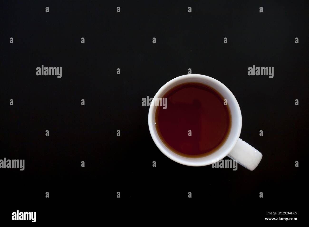 Cup of tea on black table, top view. Food background Stock Photo - Alamy