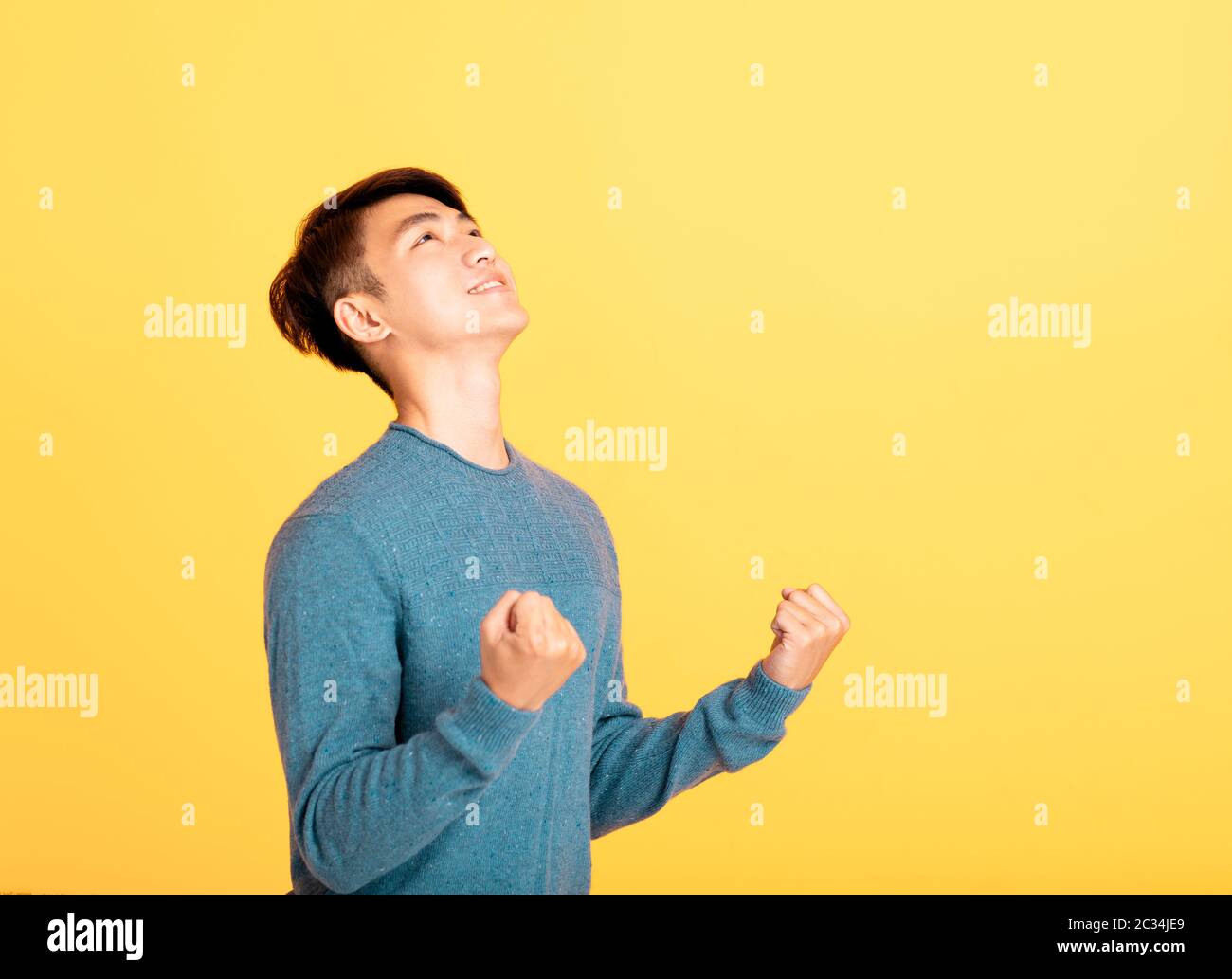 excited young man looking up Stock Photo - Alamy