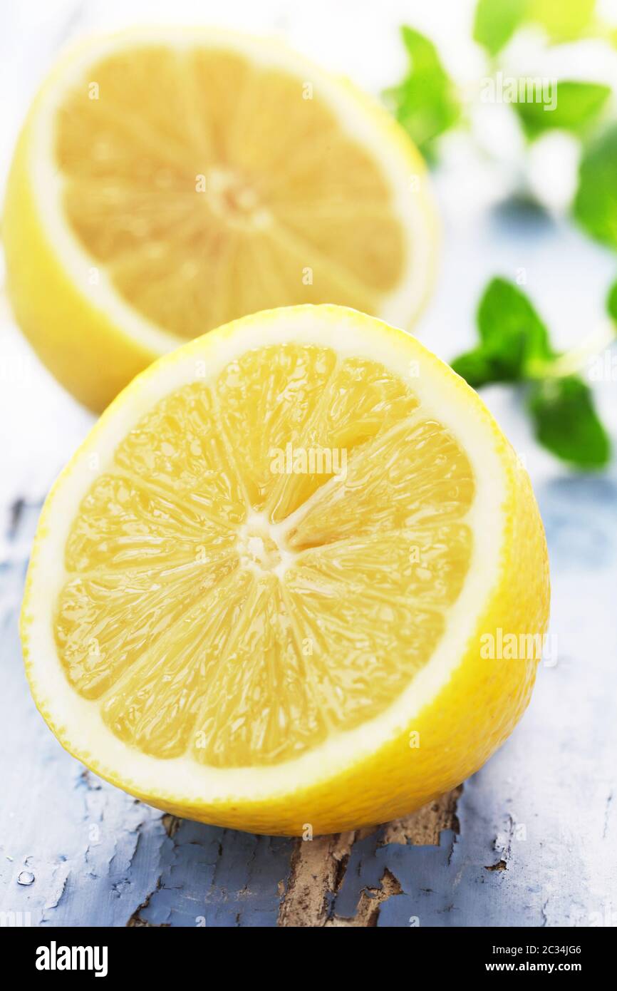 Lemon Halves On A Blue Background Stock Photo - Alamy