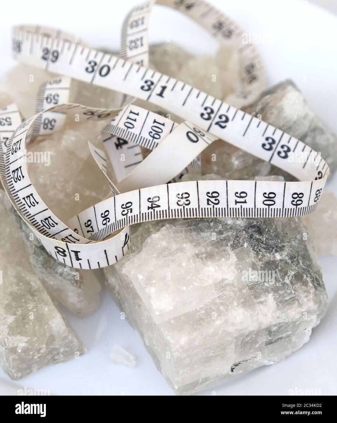 salt and weight gain, large pieces of salt and tape measure Stock Photo ...