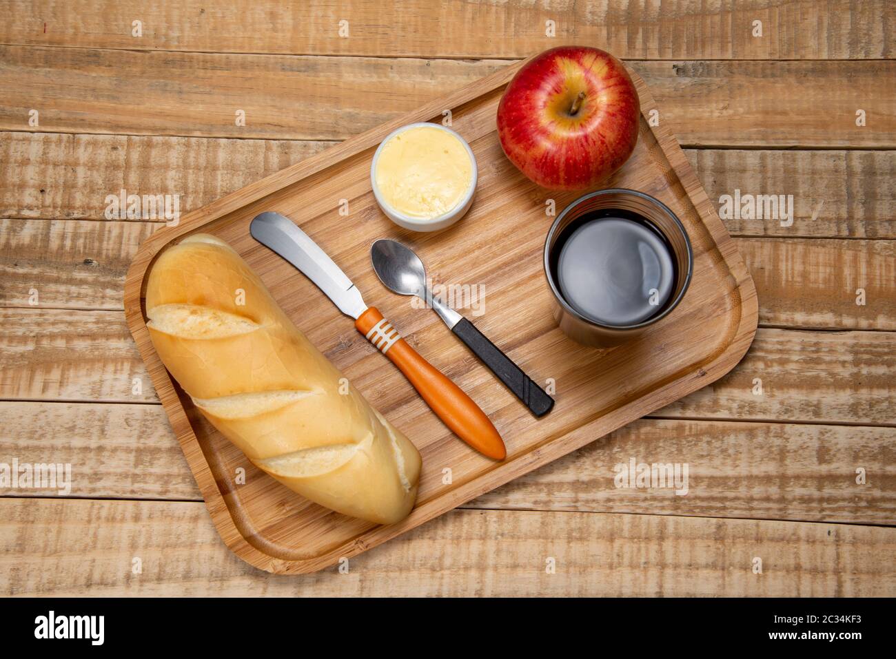 simple breakfast, with bread and butter, coffee and fruit. Top View ...