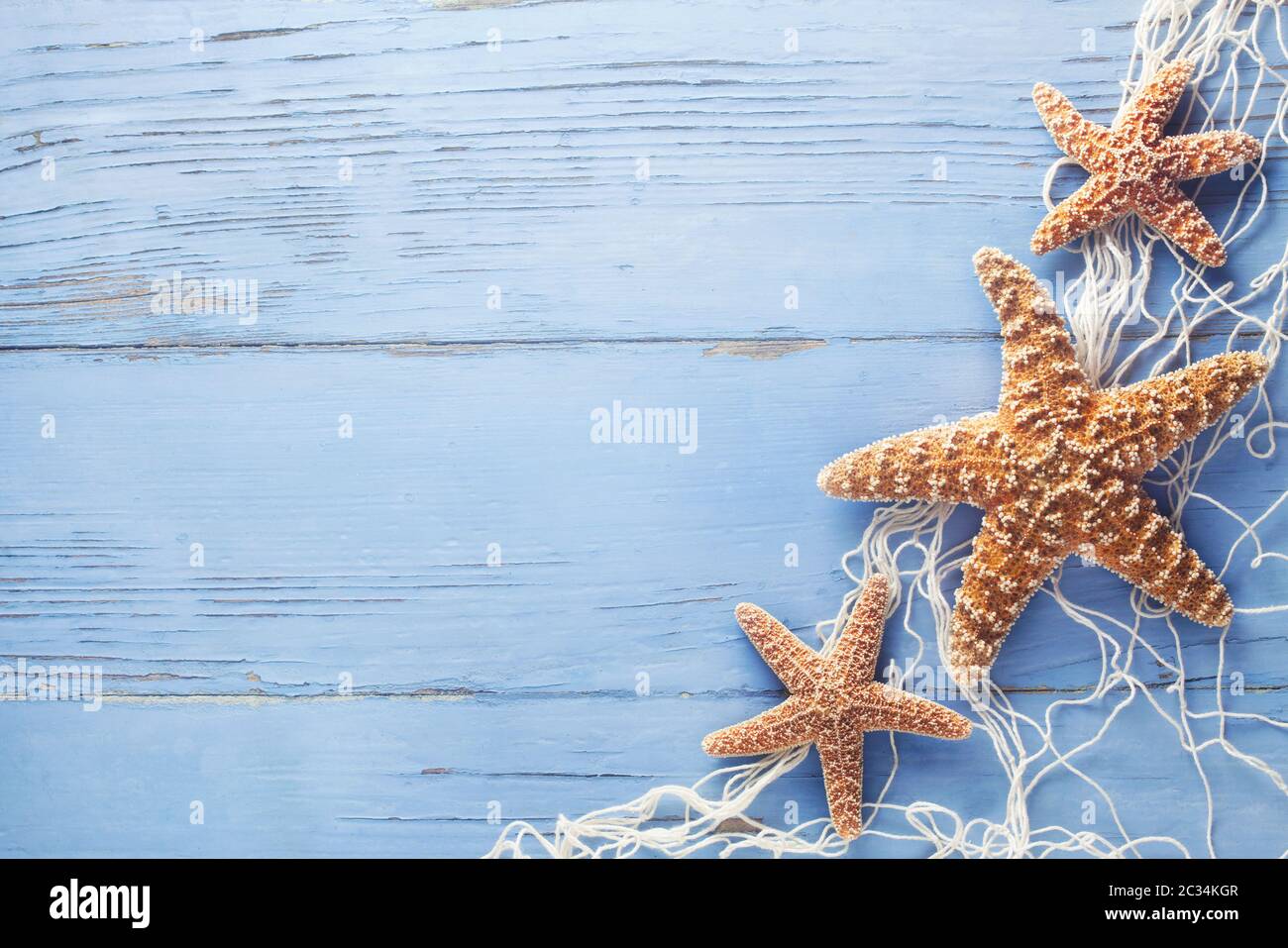 Maritime Background With Starfish And A Fishing Net Stock Photo - Alamy