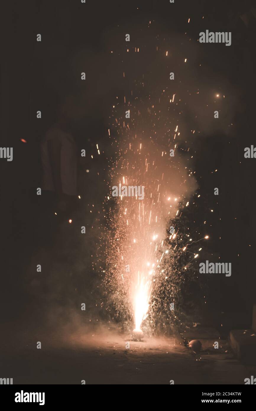 Bright and colorful fireworks showing display at night in City Street ...