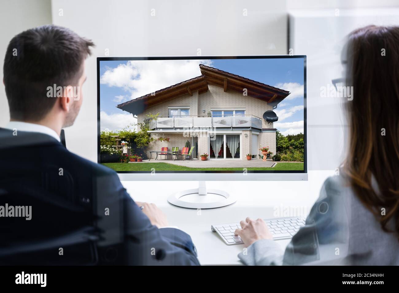 Businesspeople looking computer screen hi-res stock photography and ...