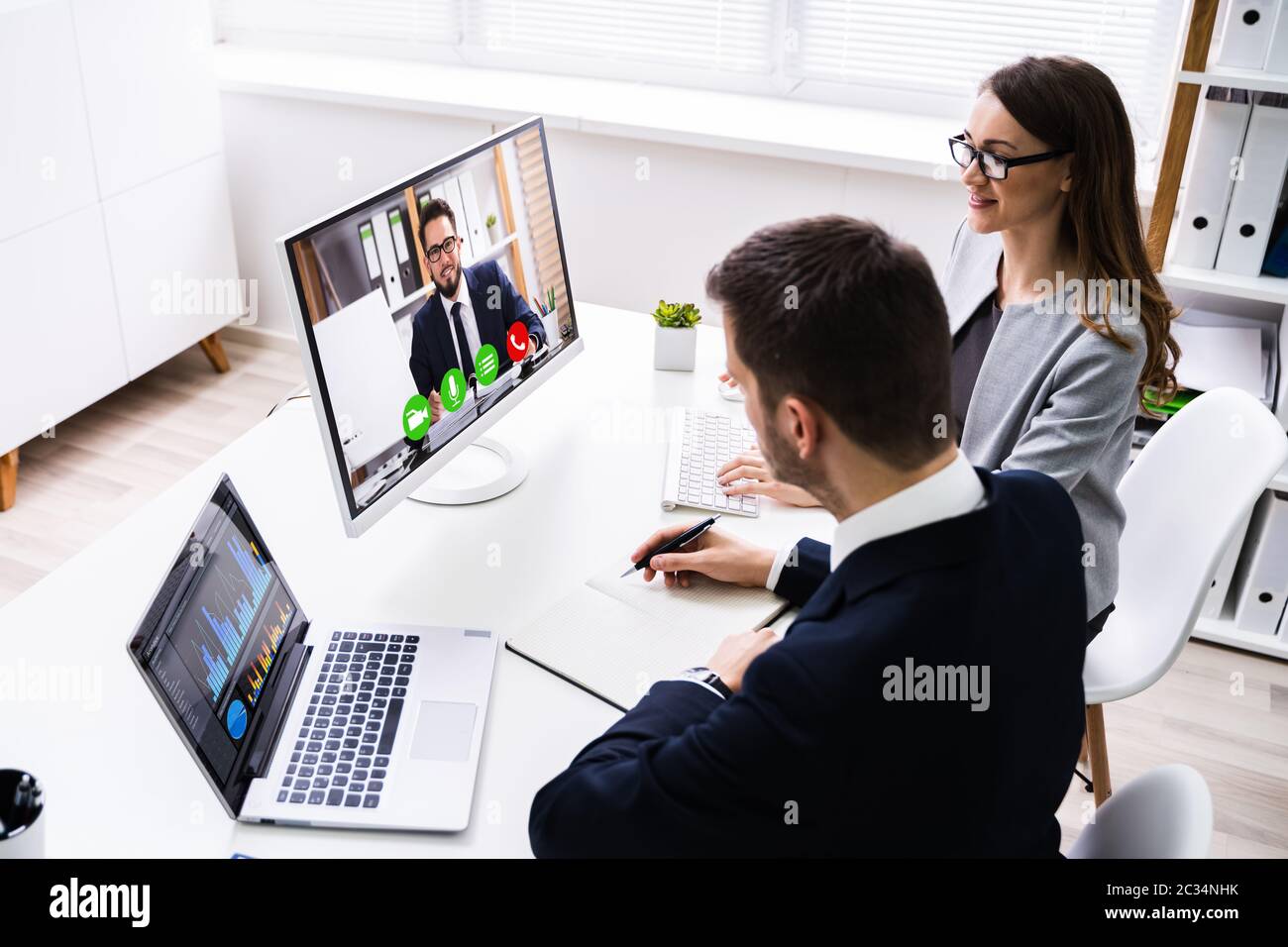 Computer two people conferencing hi-res stock photography and images ...