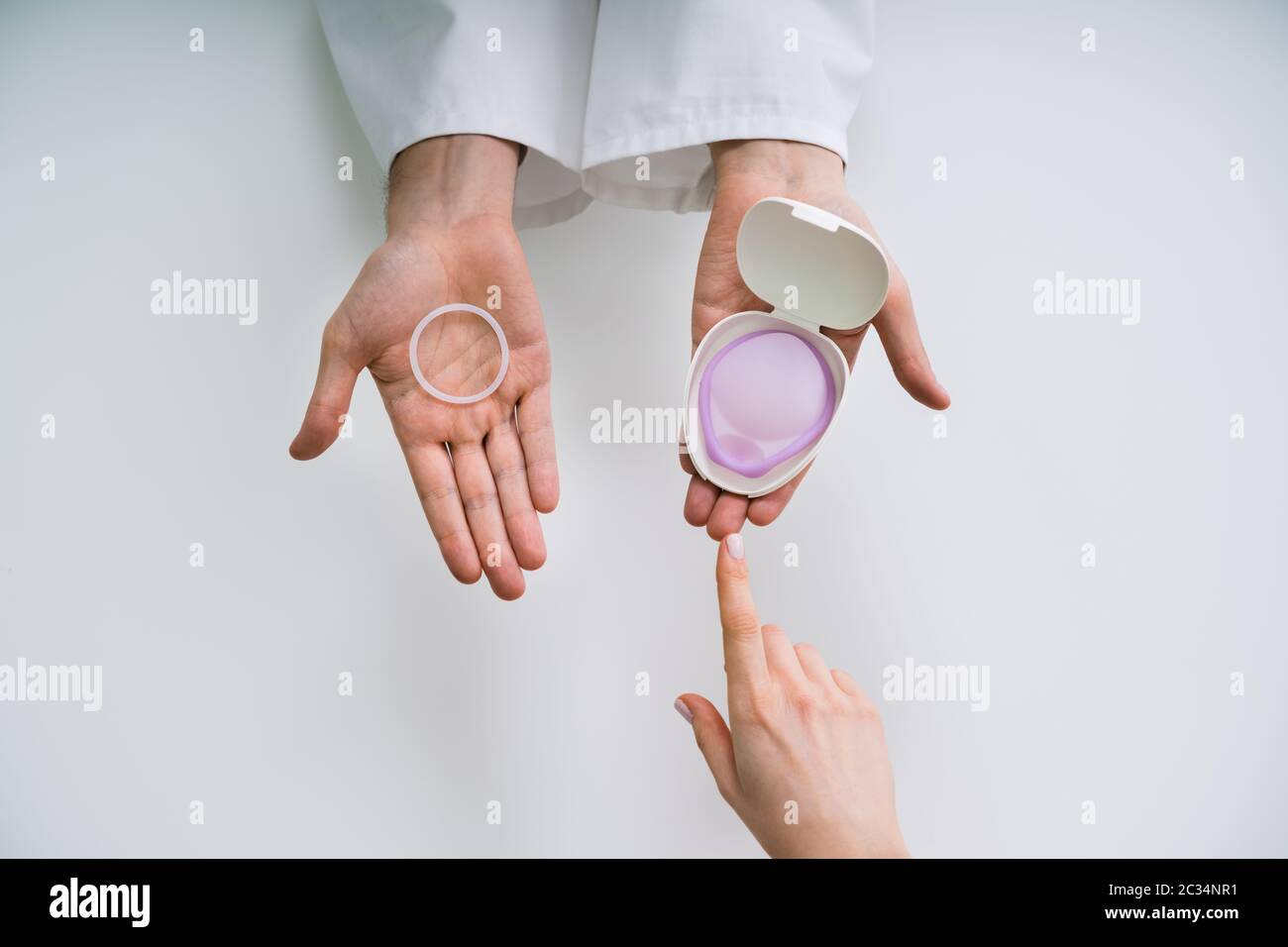 Gynecologist Consulting Woman On Diaphragm Contraception And Birth ...