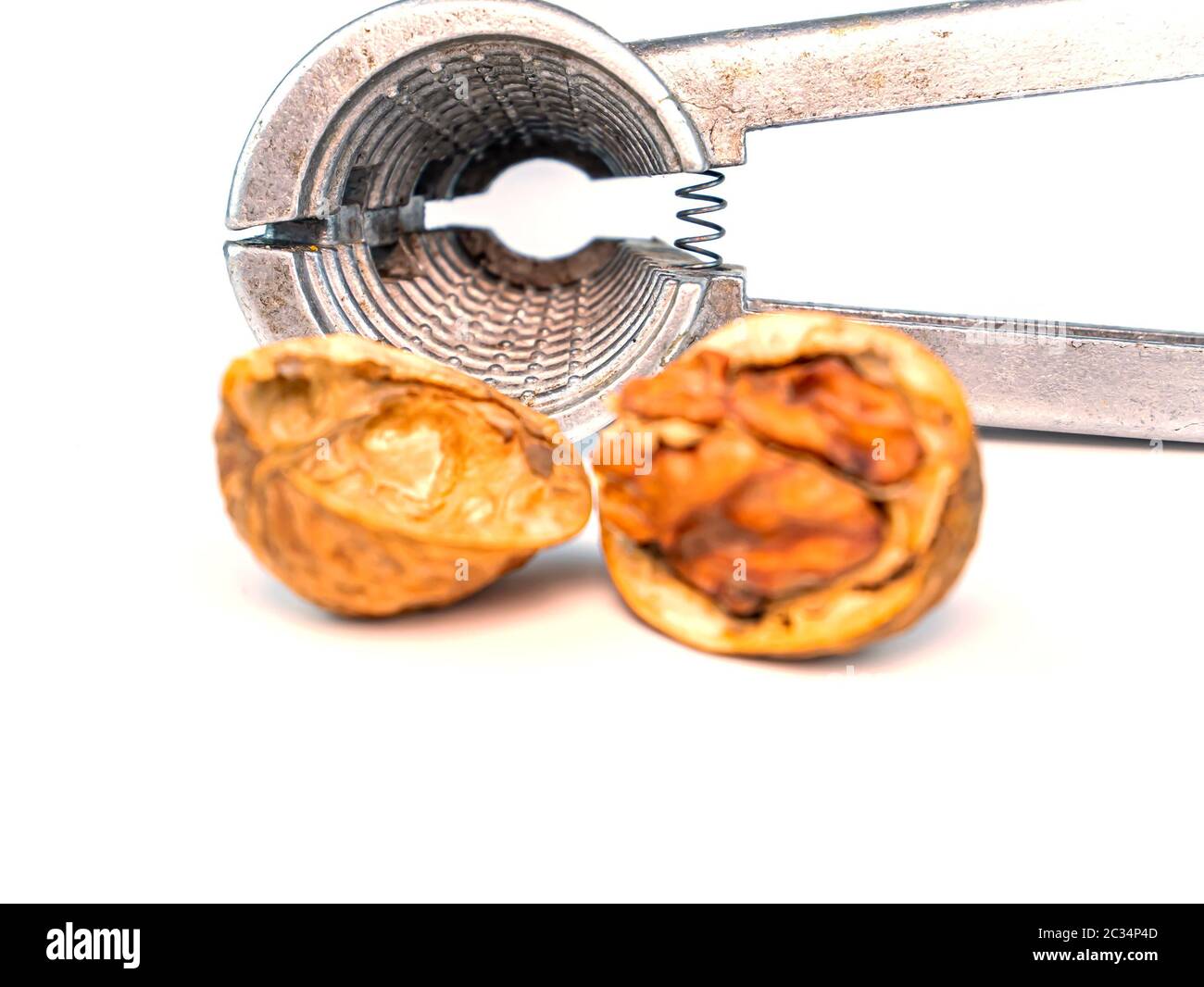 Cracking walnuts on a white background with place for text. Free place ...