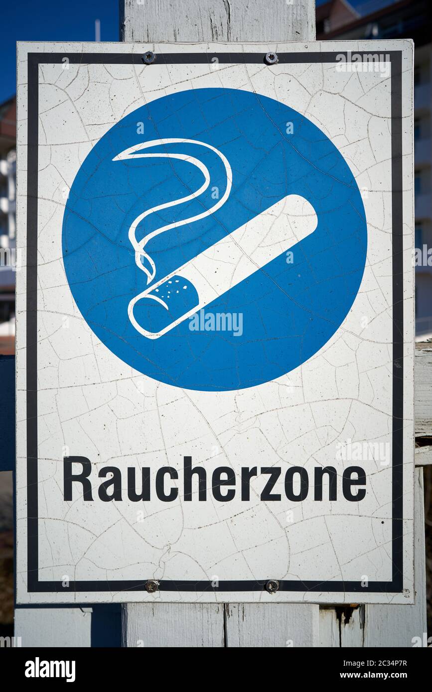 Sign with the inscription "Smoking zone" in front of a hospital Stock ...