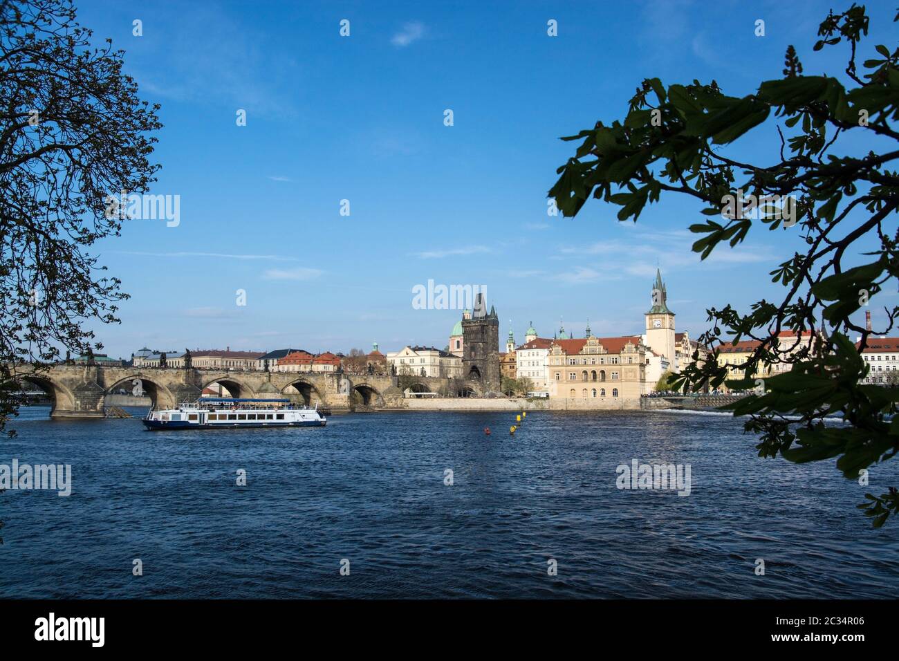 Charles Bridge is a historic bridge that crosses the Vltava river in ...