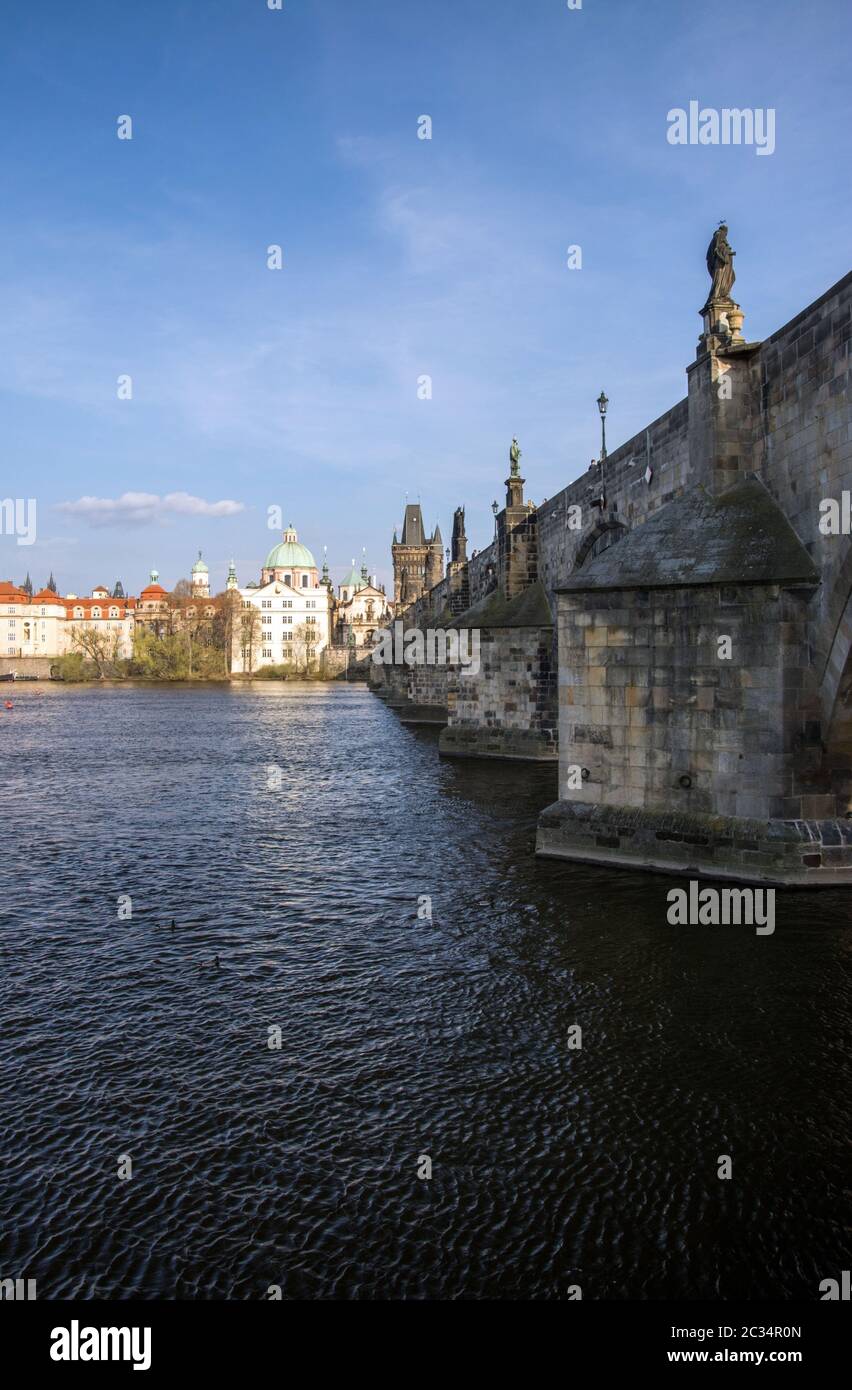 Charles Bridge is a historic bridge that crosses the Vltava river in ...